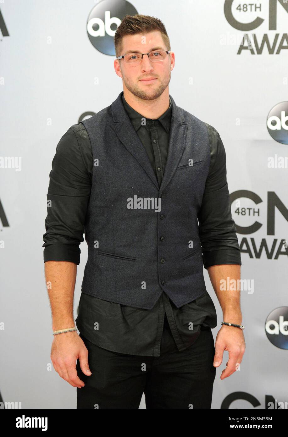 Tim Tebow arrives at the 48th annual CMA Awards at the Bridgestone ...