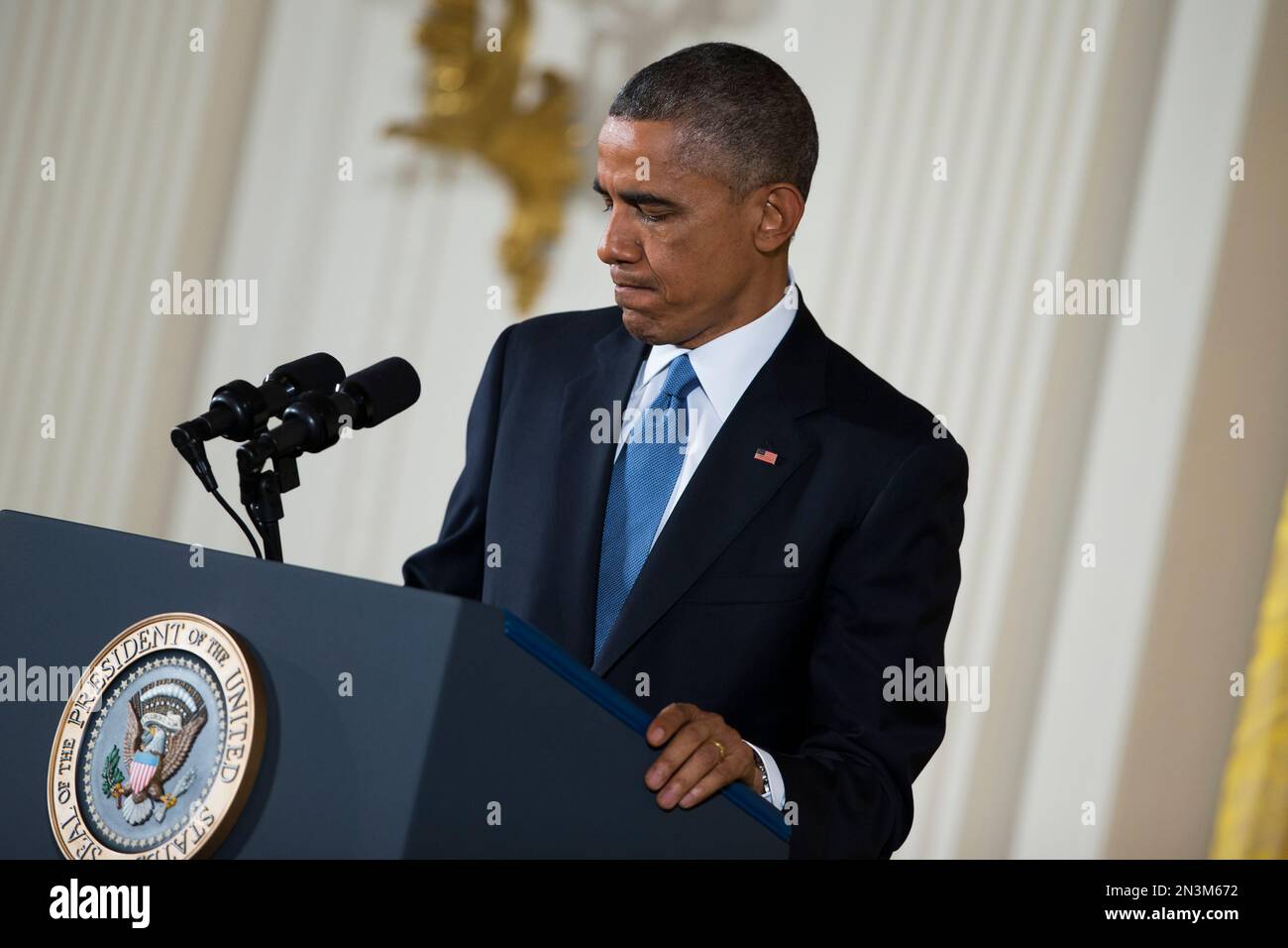 President Barack Obama pauses during a news conference in the East Room ...