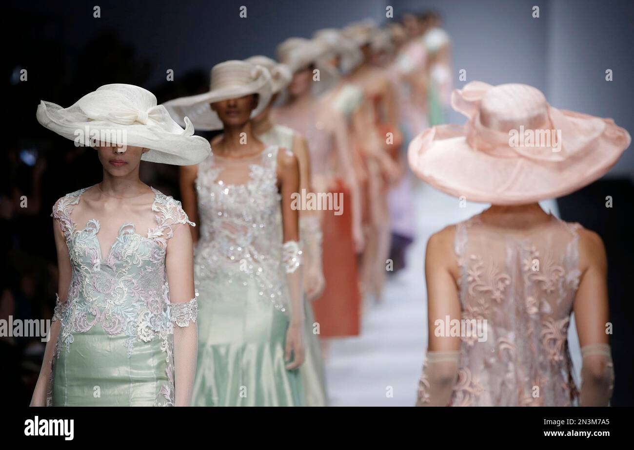 Models display creations by Jeanny Ang during the Jakarta Fashion Week ...