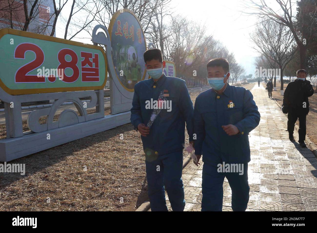 People walk on a street of Pothonggang District in Pyongyang, North ...