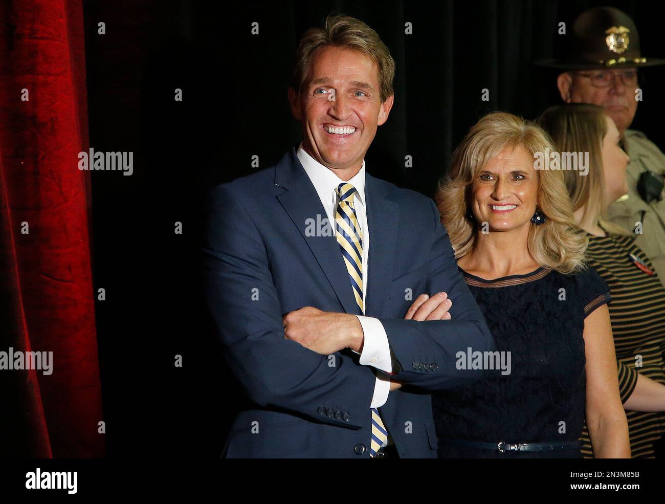 Arizona Republican Sen. Jeff Flake, left, smiles as he waits off stage ...