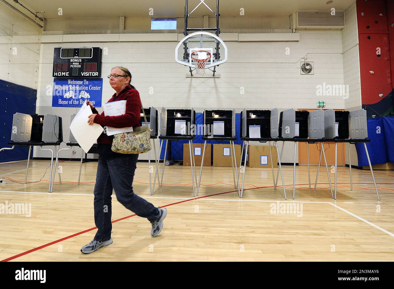 Elena Foss, 57, prepares to turn her ballot after voting at the Barnum ...