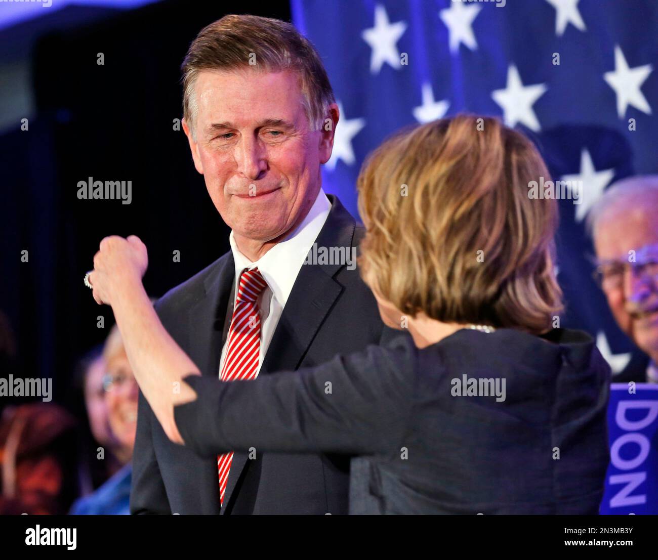 U.S. Rep.-elect, Don Beyer gets a hug from his wife, Megan, right ...