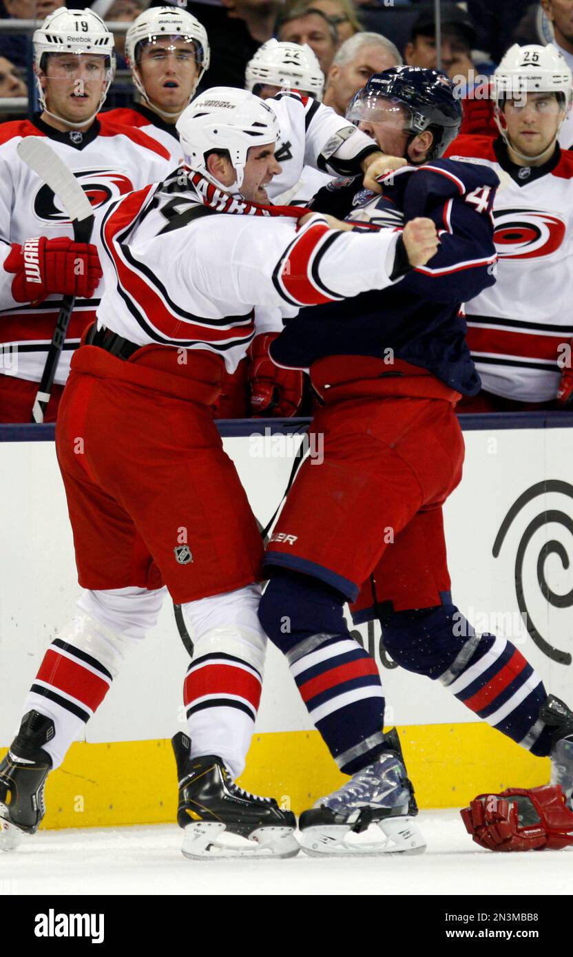 Columbus Blue Jackets' Scott Hartnell, right, and Carolina Hurricanes ...