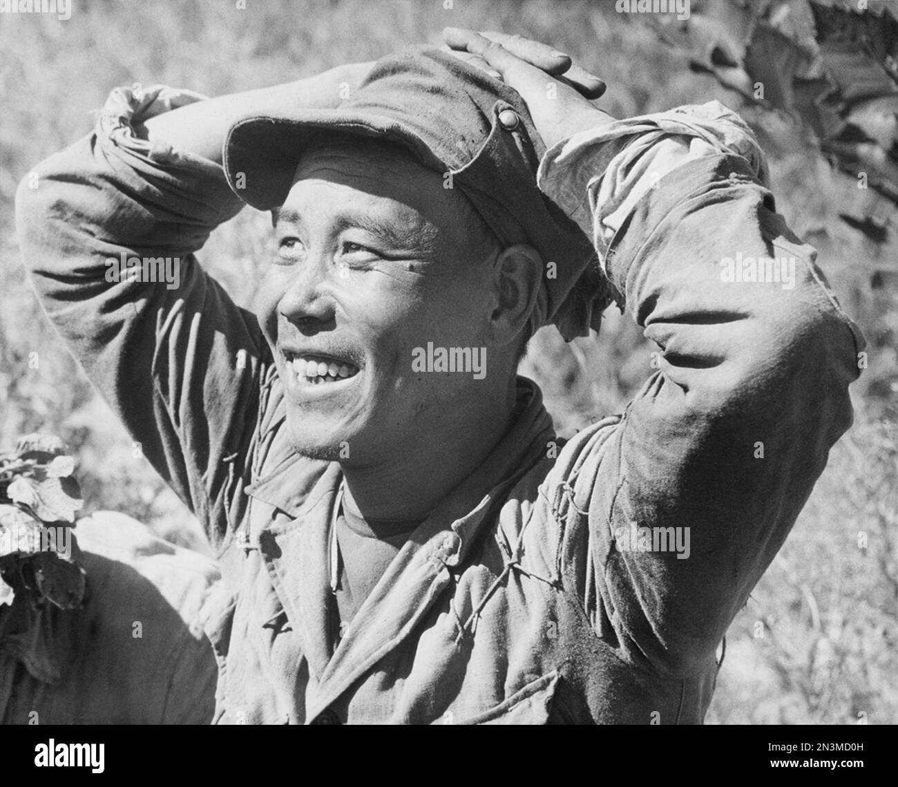 A North Korean soldier smiles after his capture at Kimpo airfield near ...