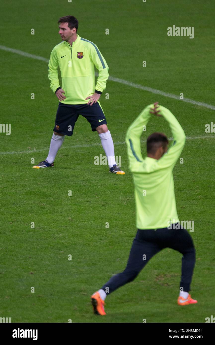 Barcelona's Lionel Messi, top, and Barcelona's Neymar do stretching ...
