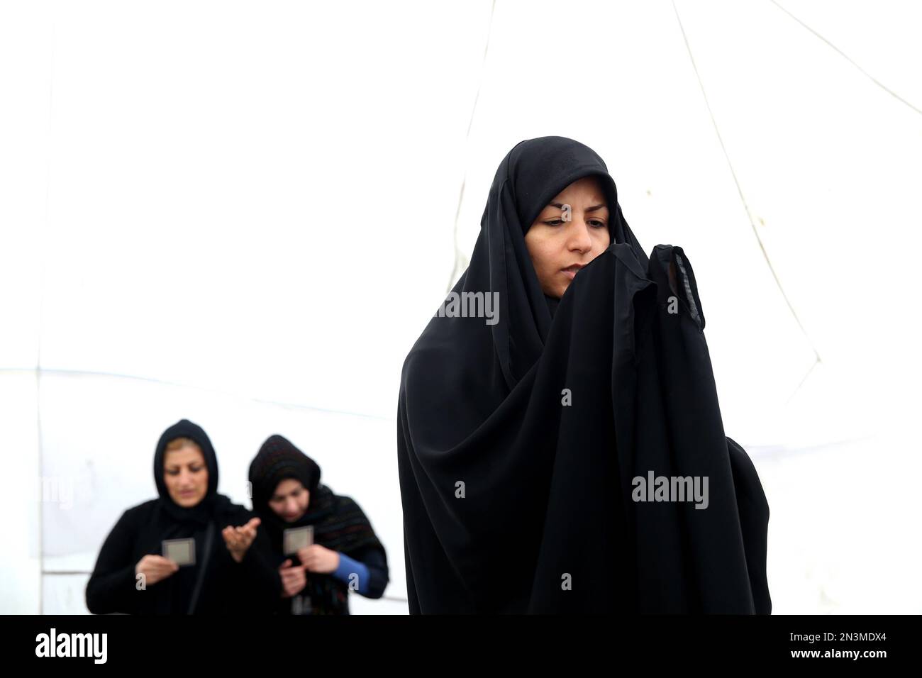 Iranian Shiite mourners pray while attending Ashoura rituals ...