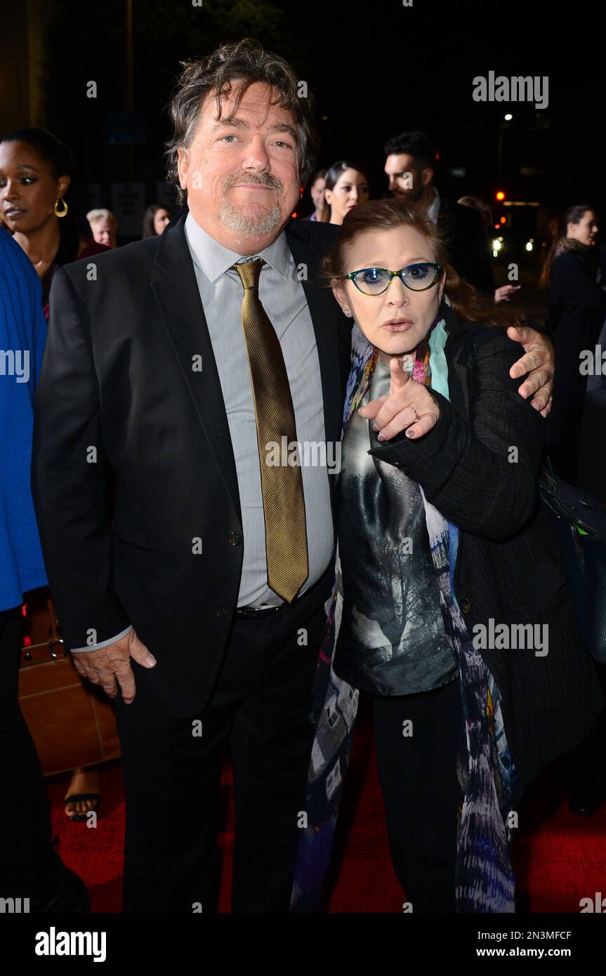 Charles B. Wessler, left, and Carrie Fisher arrive at the premiere of ...