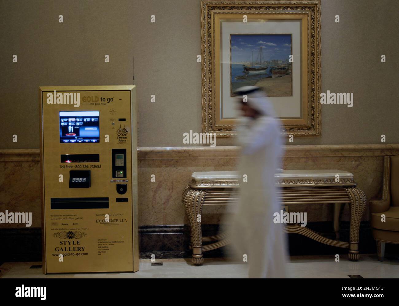 In this Wednesday, Aug. 24, 2011 photo, An Emirati man passes by a ...