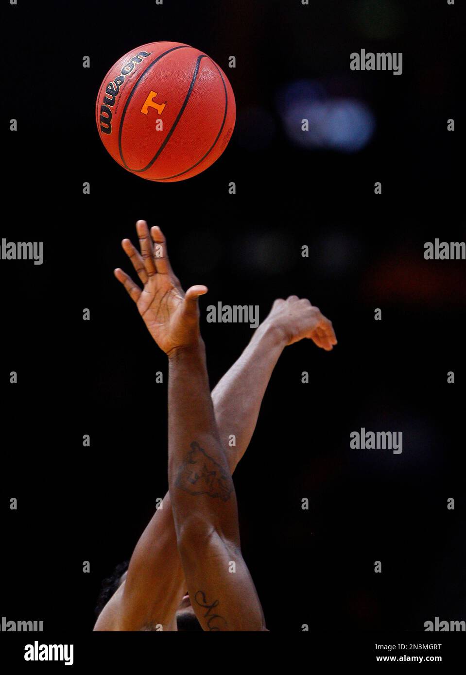 The ball is tipped in the first half of an NCAA college basketball game ...