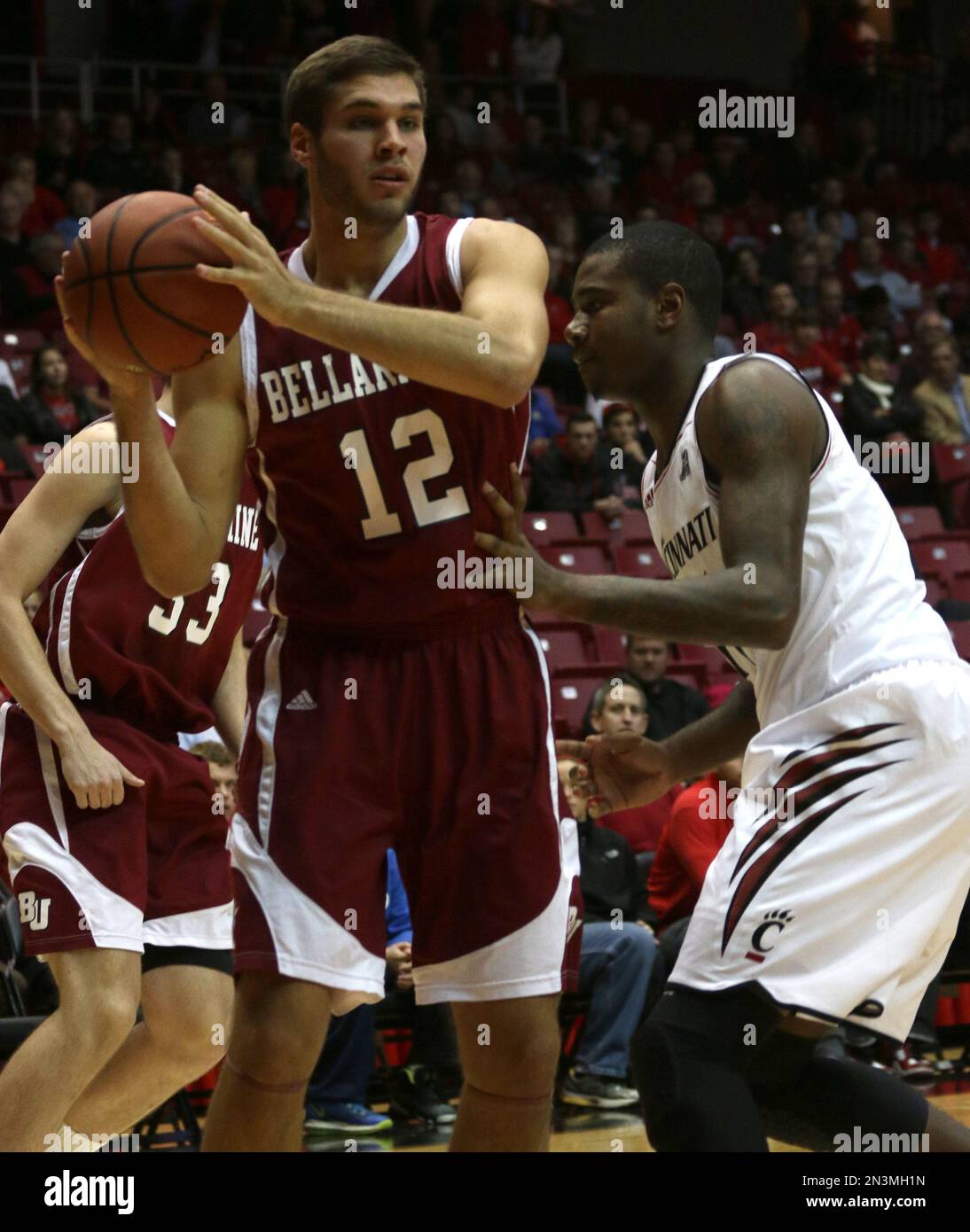 Cincinnati's Gary Clark, right, tries to keep Bellarmine's Jake Thelen ...
