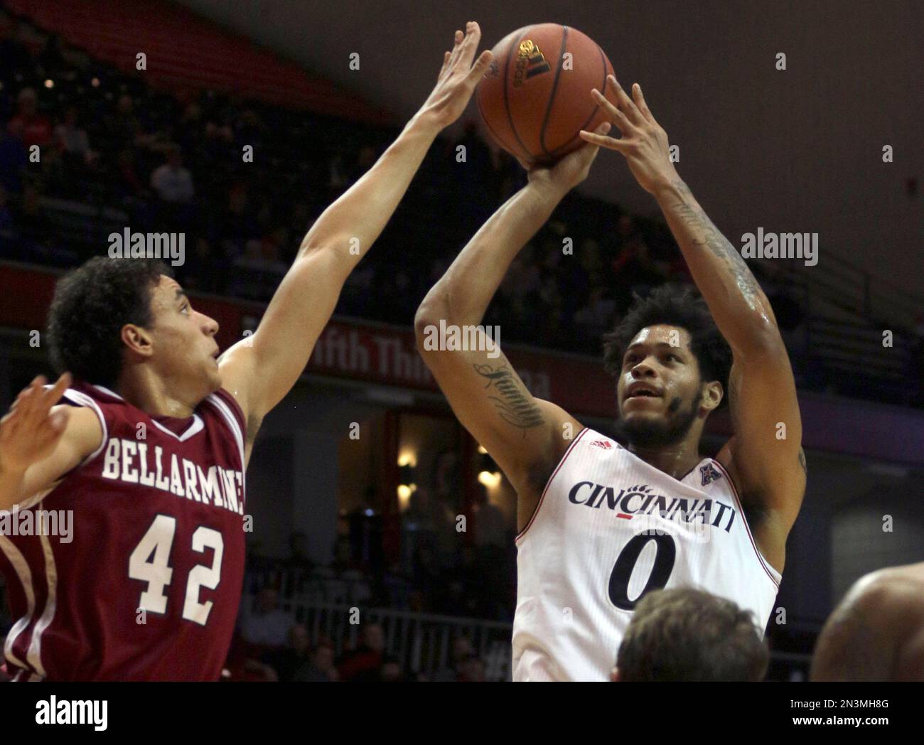 Cincinnati's Octavius Ellis, right, shoots past Bellarmine's Tyler ...