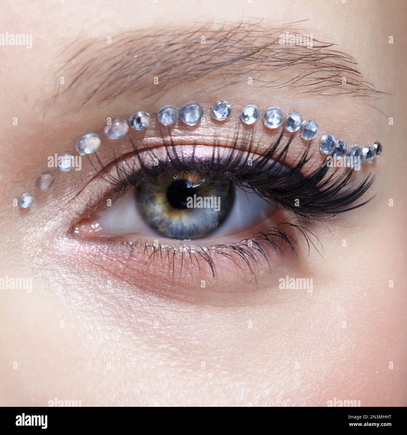 Closeup macro shot of human female eye with unusual makeup. Woman with ...