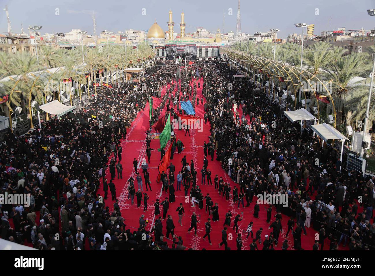 Shiite Muslim worshippers gather in front of the holy shrine of Imam ...