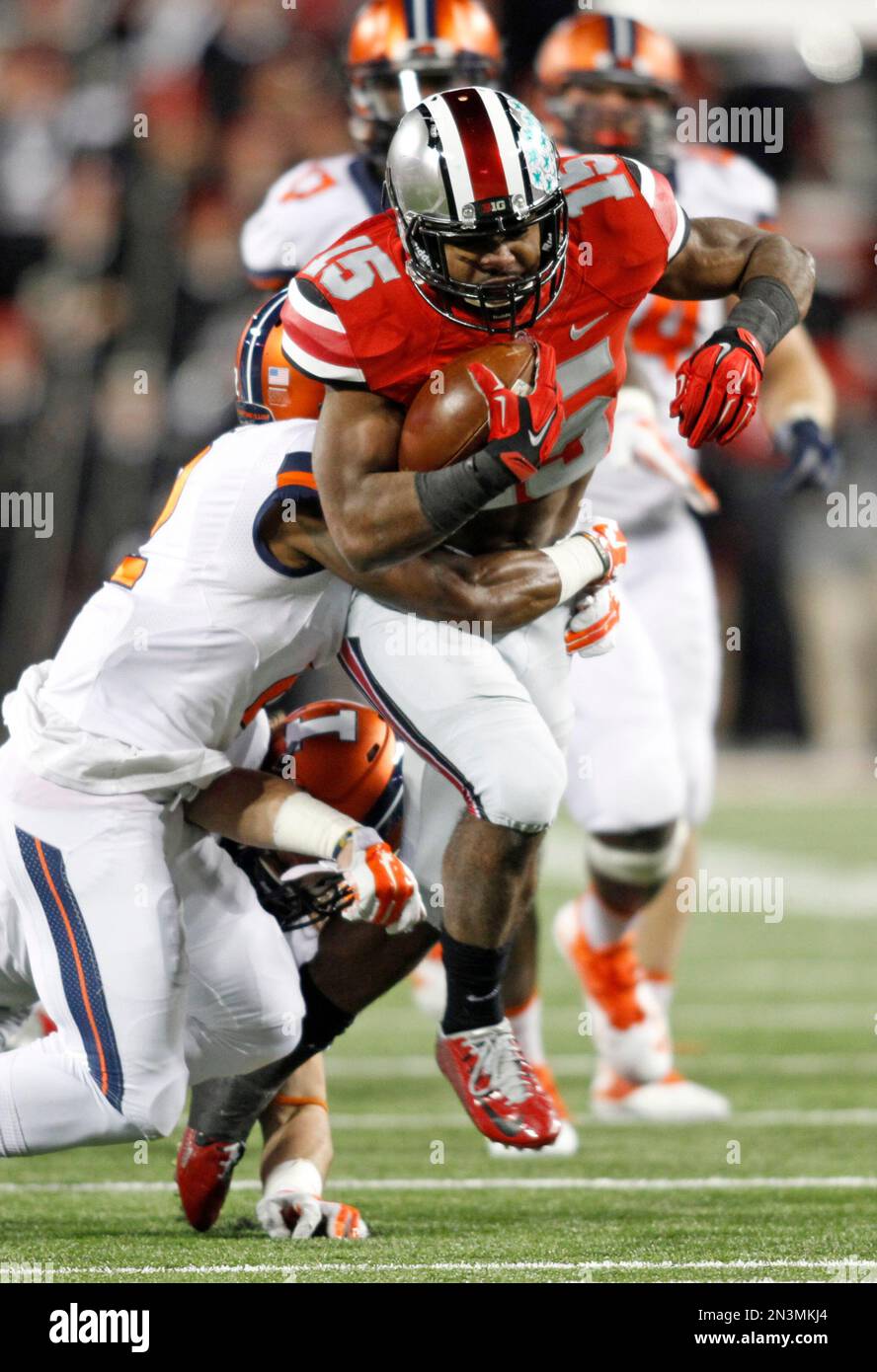 Ohio State running back Ezekiel Elliott, right, tries to get past ...