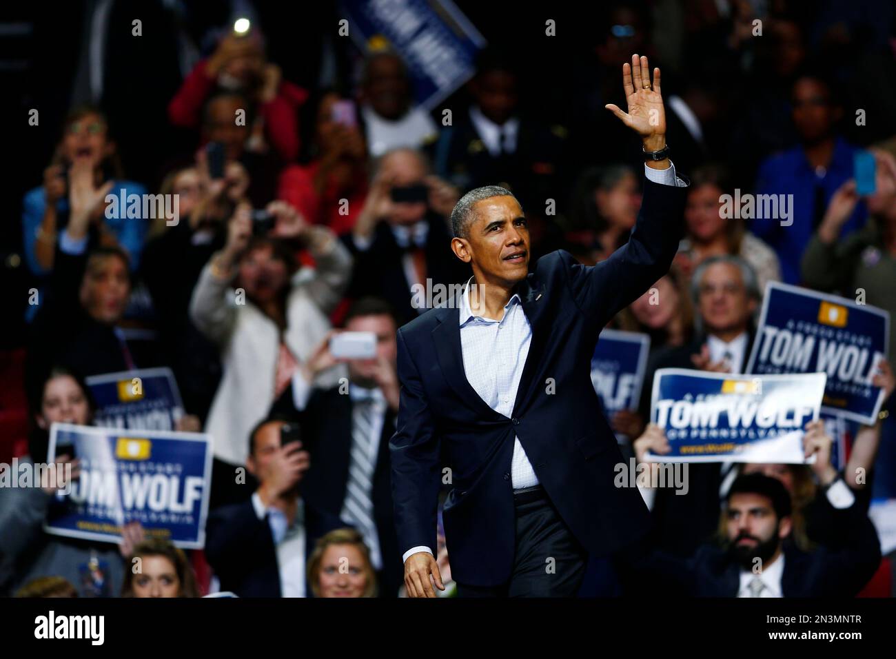 President Barack Obama waves to the crowd at Temple University as he ...