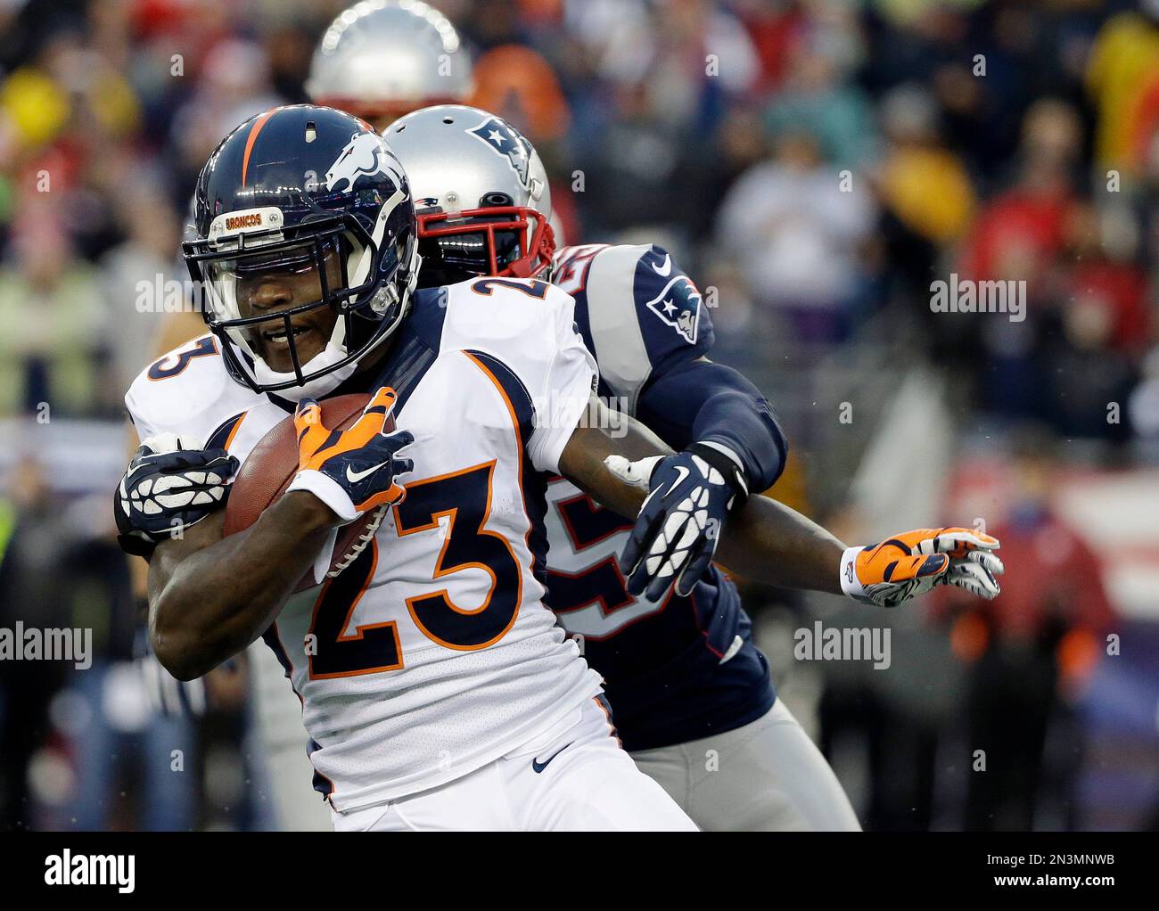 New England Patriots cornerback Kyle Arrington, rear, wraps up Denver ...