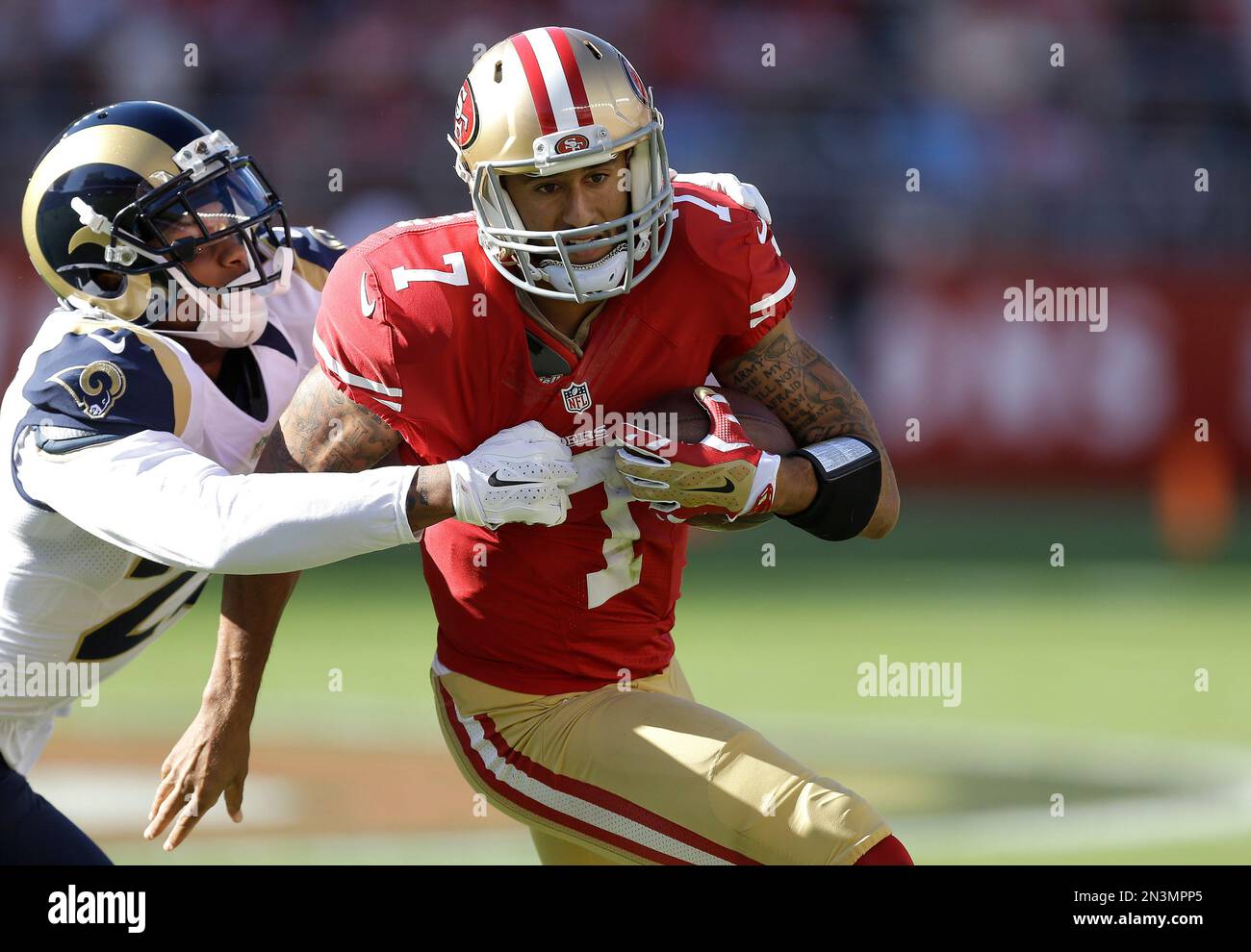 San Francisco 49ers quarterback Colin Kaepernick (7) runs from the ...