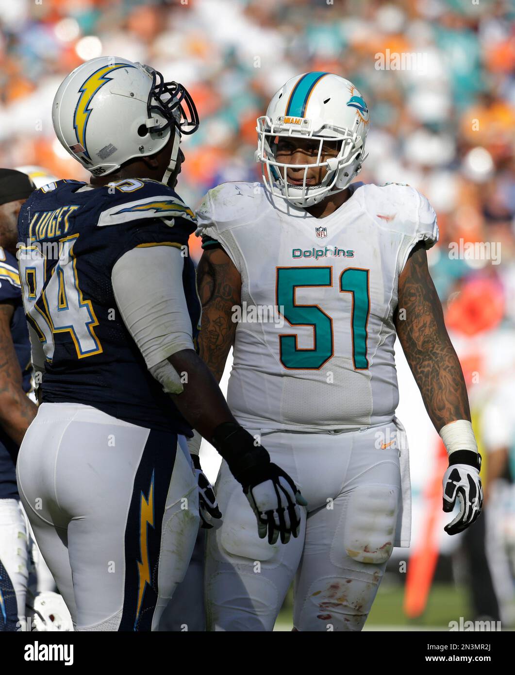 San Diego Chargers defensive end Corey Liuget (94) talks to Miami ...