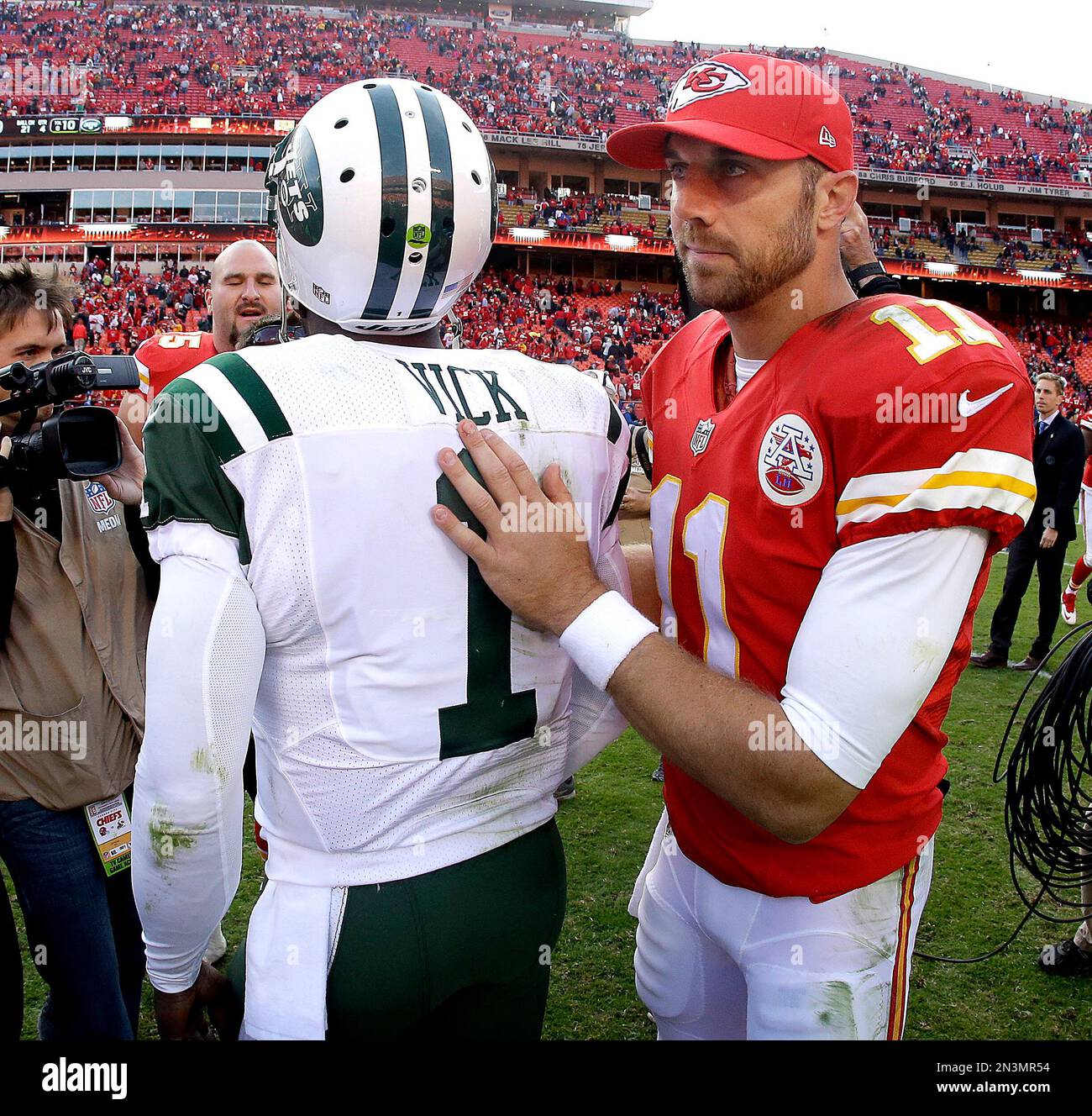 Kansas City Chiefs quarterback Alex Smith (11) talks with New York Jets ...