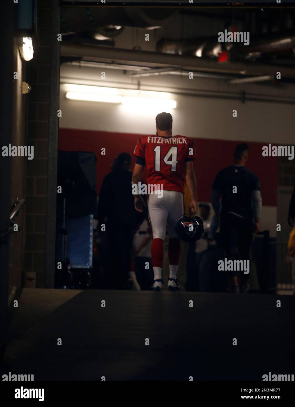Houston Texans quarterback Ryan Fitzpatrick walks to the locker room ...