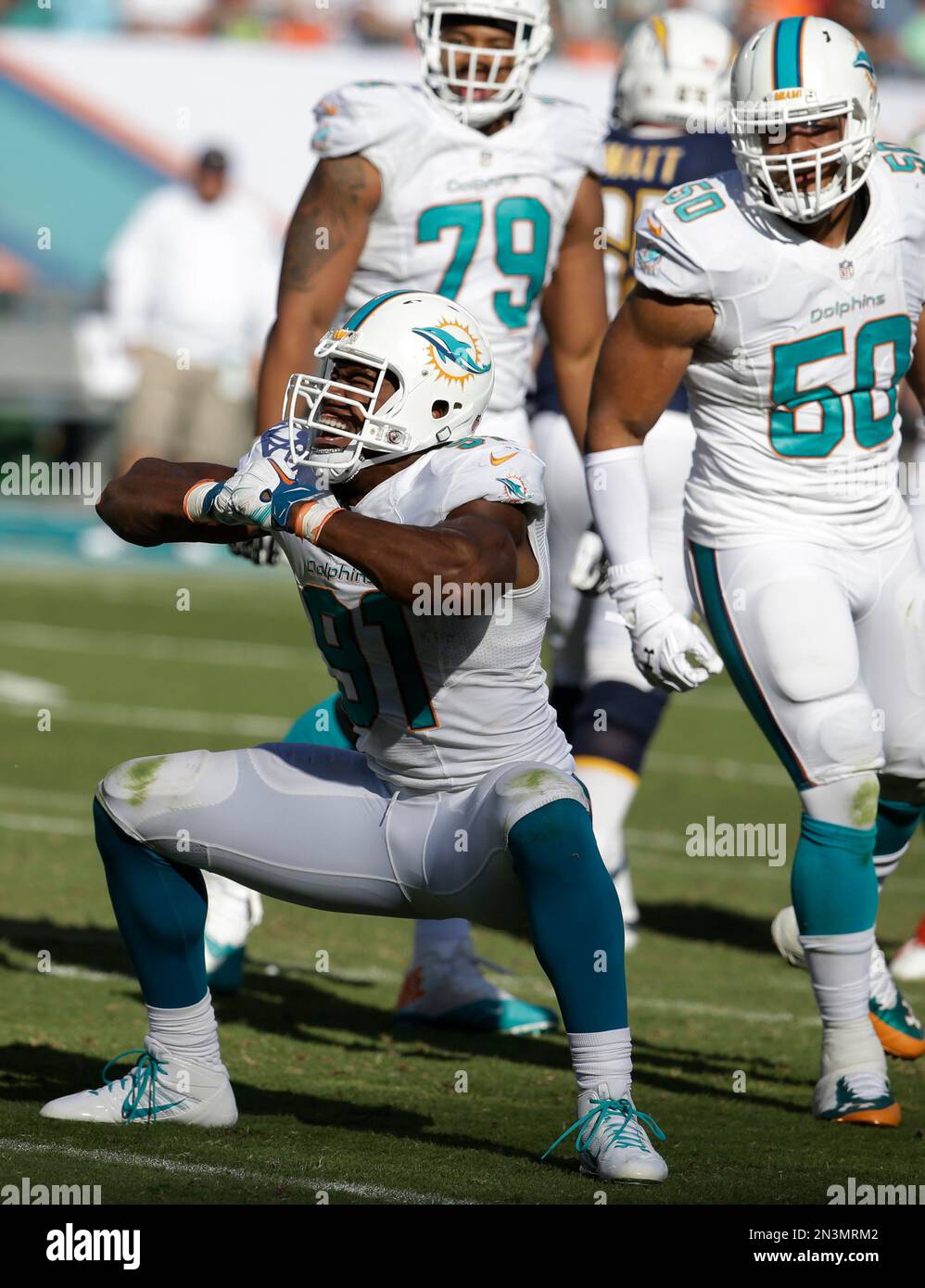Miami Dolphins defensive end Cameron Wake (91) celebrates after a sack ...