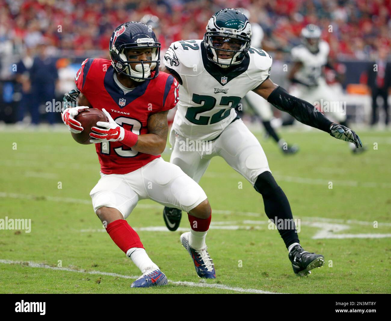 Houston Texans wide receiver Damaris Johnson, left, catches a pass as ...