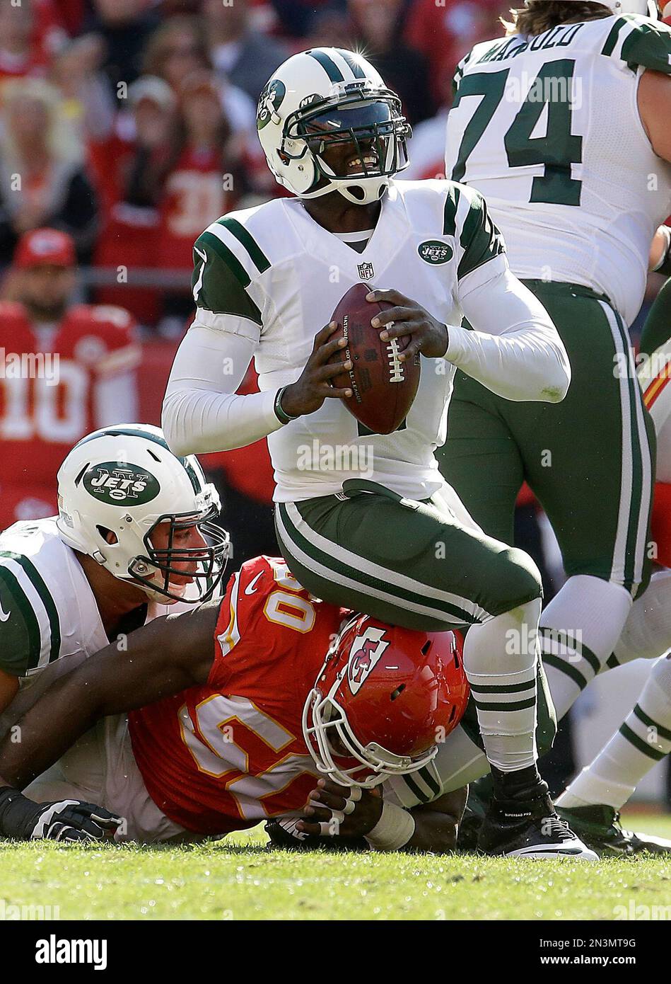 New York Jets quarterback Michael Vick (1) is sacked by Kansas City ...