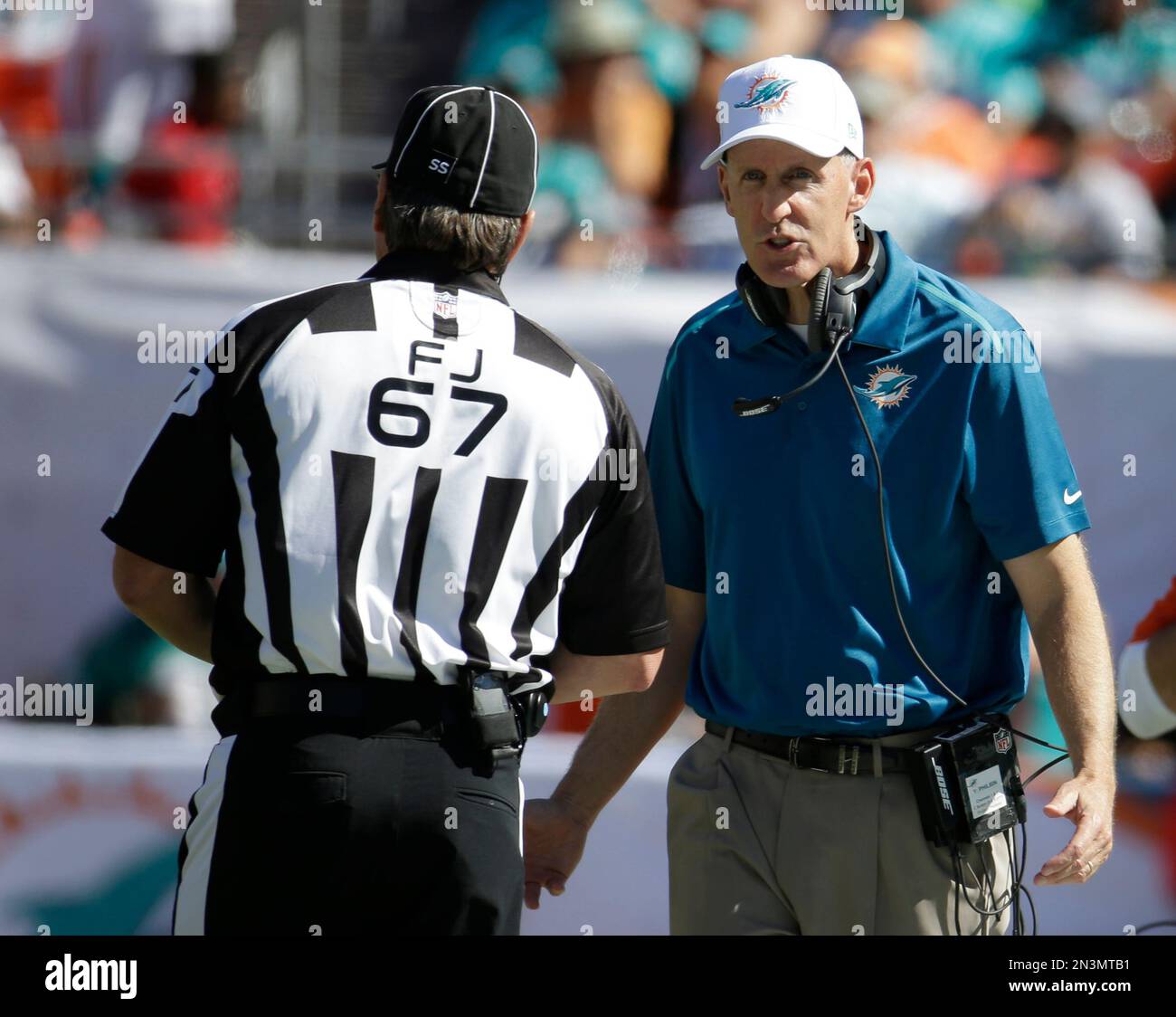 Miami Dolphins head coach Joe Philbin argues a call with field judge ...