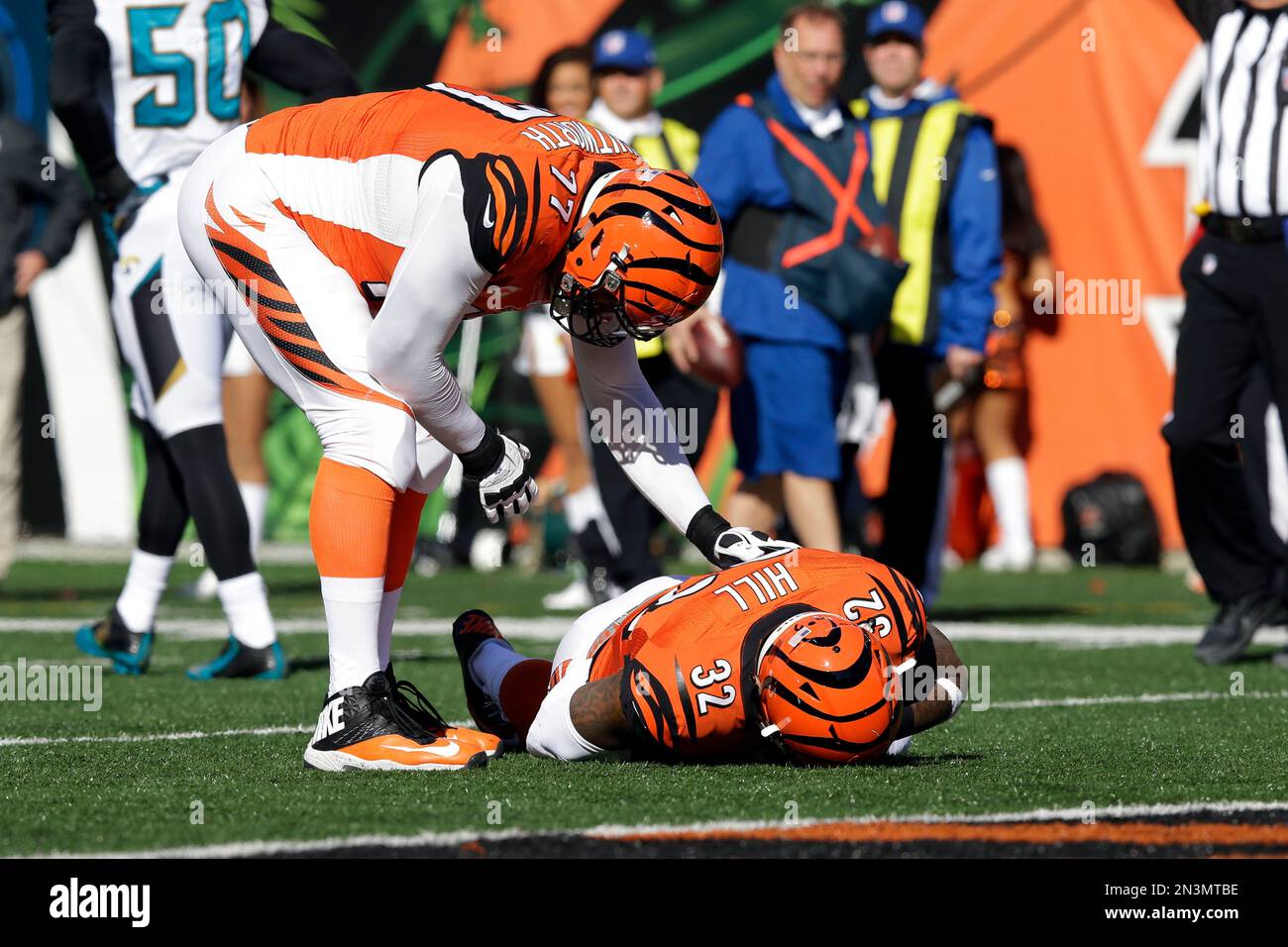 Cincinnati Bengals tackle Andrew Whitworth, top, checks on injured ...