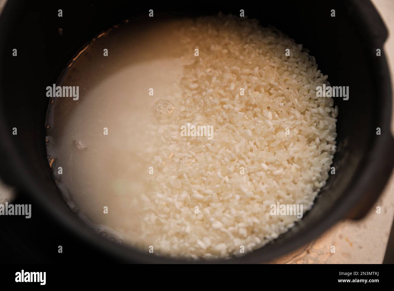 Cooking Rice steps washing and cooked preparation Stock Photo - Alamy