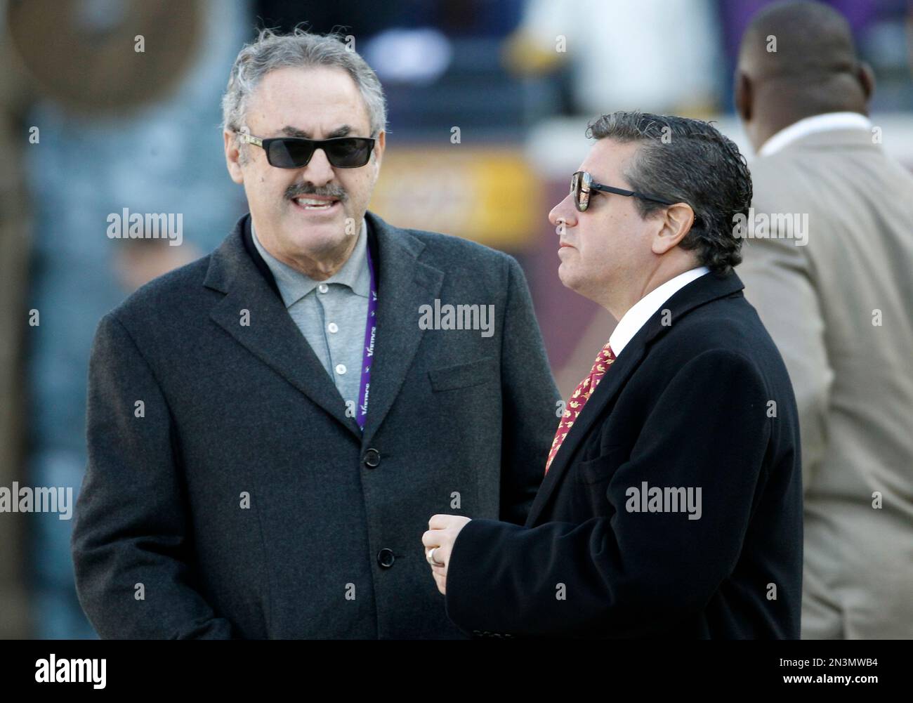 Minnesota Vikings owner Zygi Wilf, left, talks with Washington Redskins ...