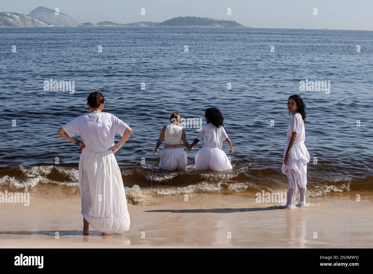 Devotees of Iemanja pray and jump waves in celebration of their goddess ...