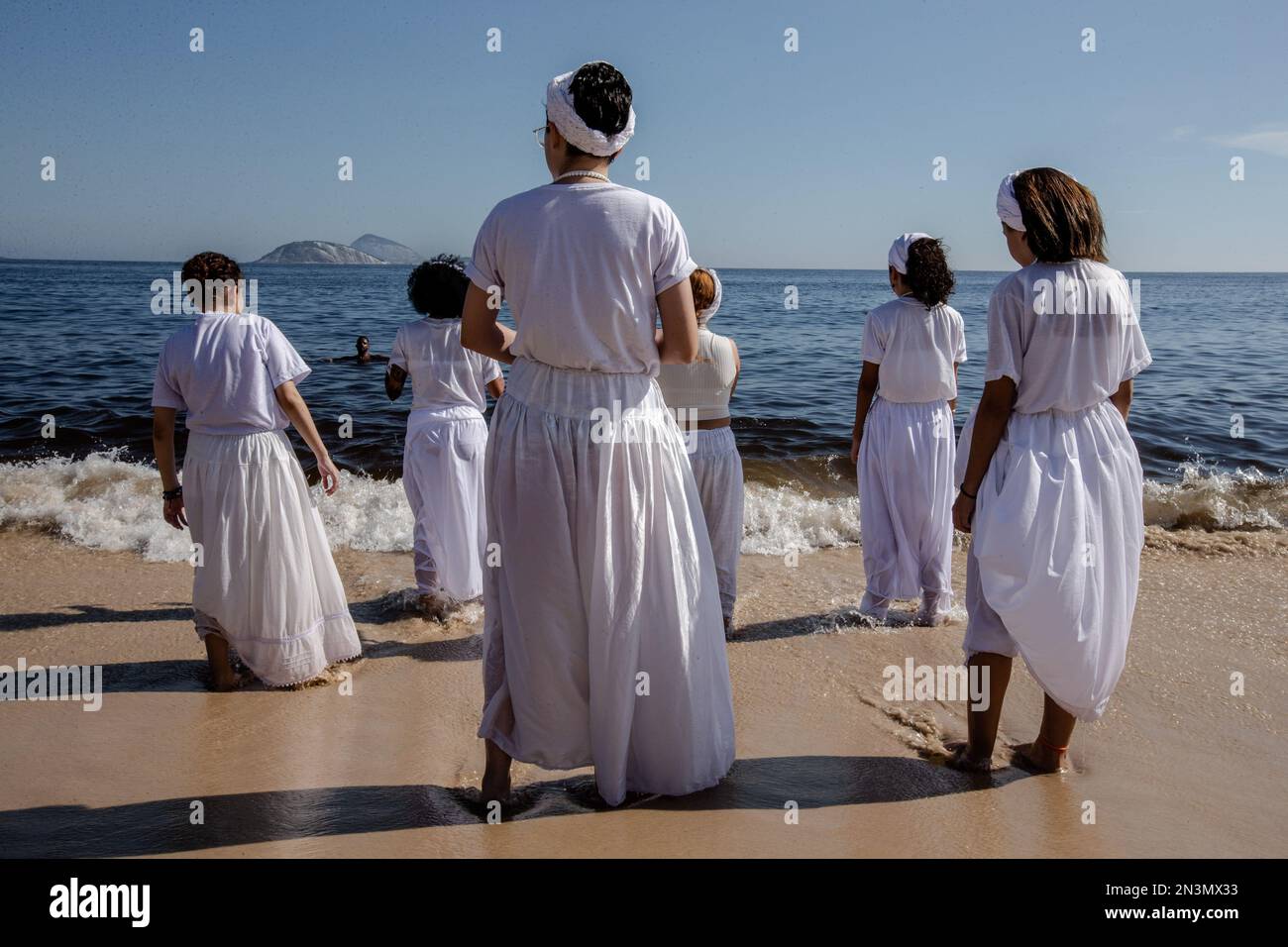 Devotees of Iemanja pray and jump waves in celebration of their goddess ...