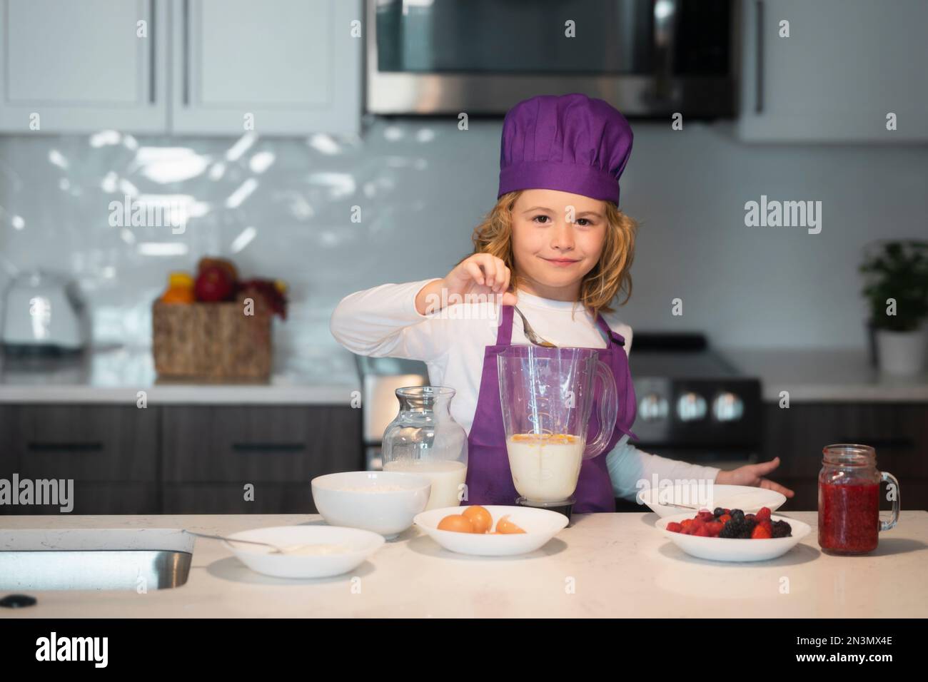 Child chef cooking meal. Funny little kid chef cook wearing uniform ...