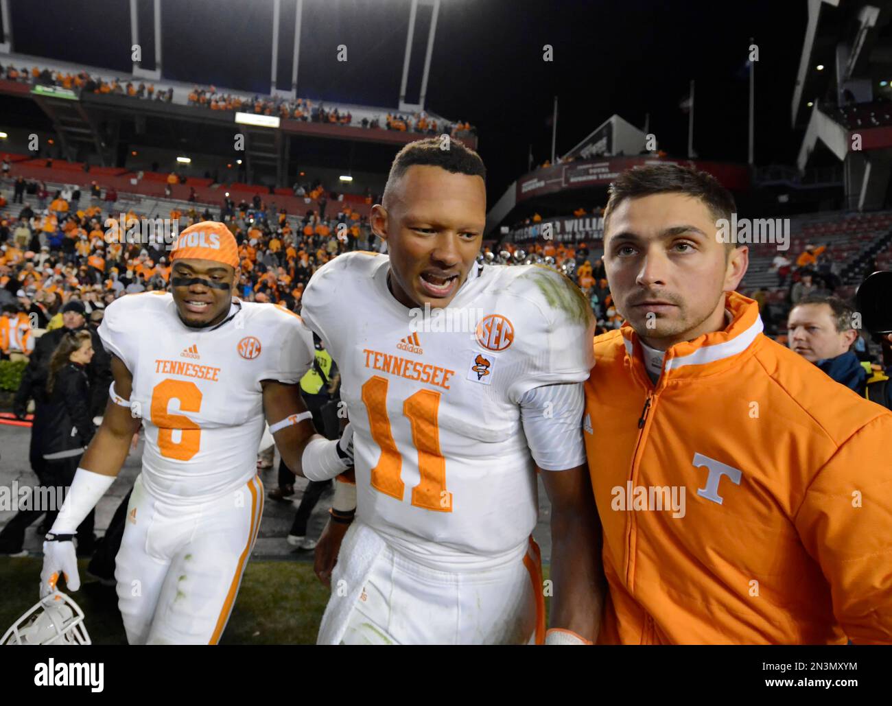 Tennessee quarterback Joshua Dobbs, center, and Todd Kelly Jr. are ...
