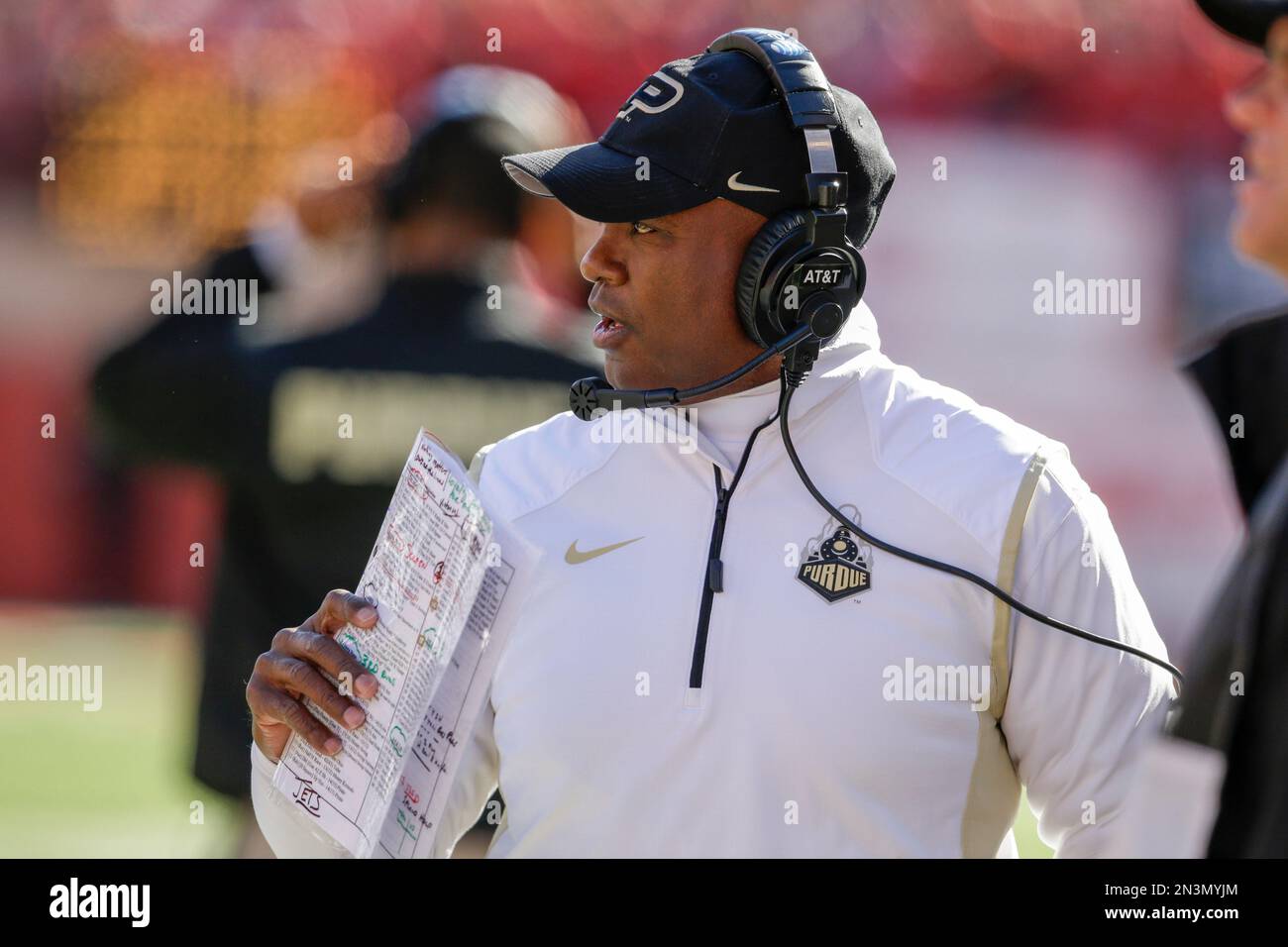 Purdue head coach Darrell Hazell follows his players in the first half ...