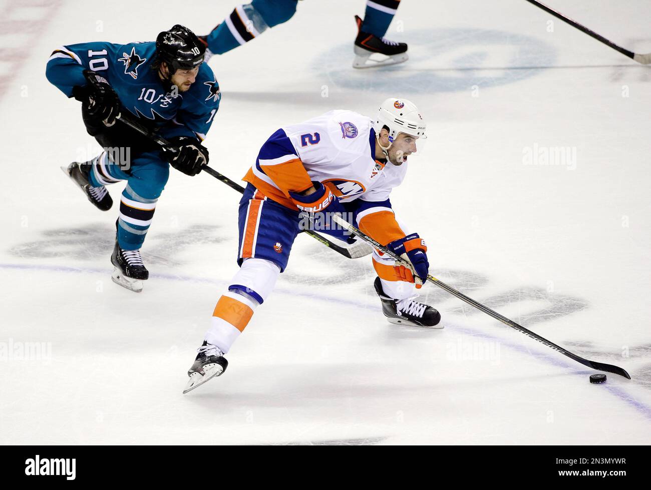 New York Islanders' Nick Leddy (2) is chased by San Jose Sharks' Andrew ...