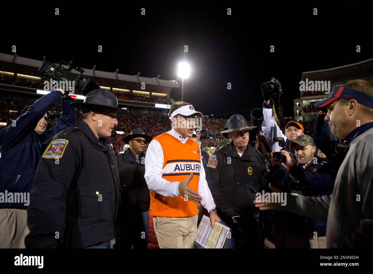 Auburn head coach Gus Malzahn and Mississippi head coach Hugh Freeze ...