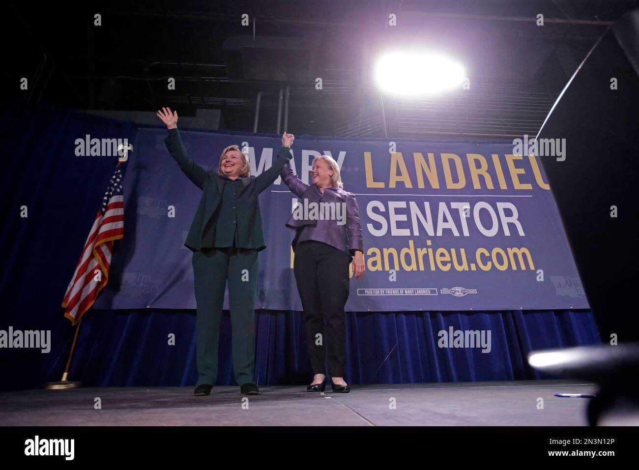 Former Secretary of State Hillary Clinton, left, responds to the crowd ...