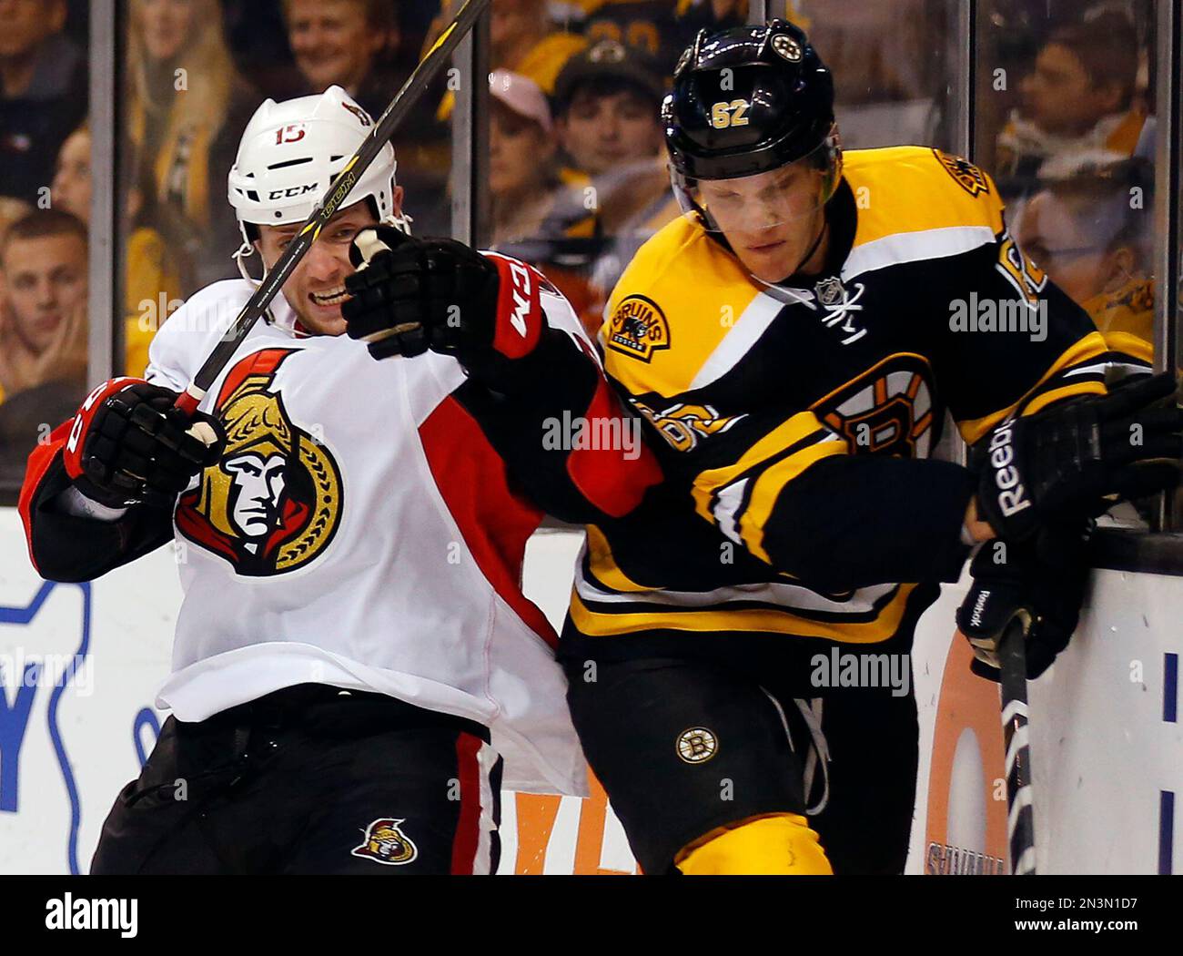 Ottawa Senators' Zack Smith (15) collides with Boston Bruins' Zach ...