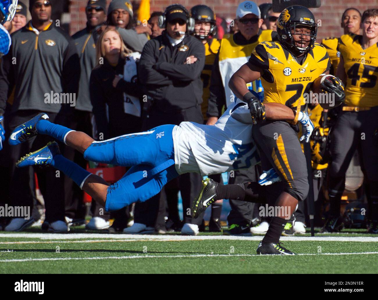 Missouri running back Ish Witter, right, runs through the tackle of ...