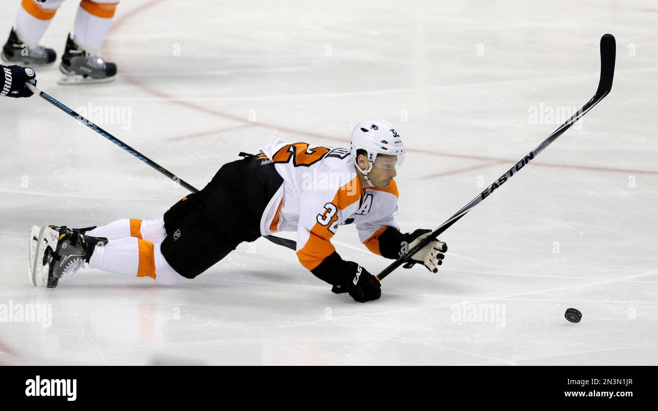 Philadelphia Flyers defenseman Mark Streit (32) goes down after he was ...