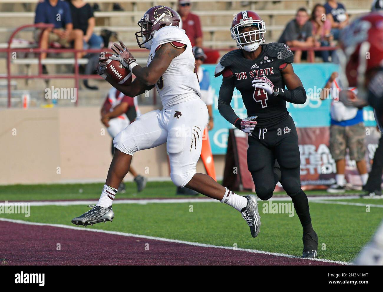 Texas State running back Terrence Franks, left, scores on a fourteen ...