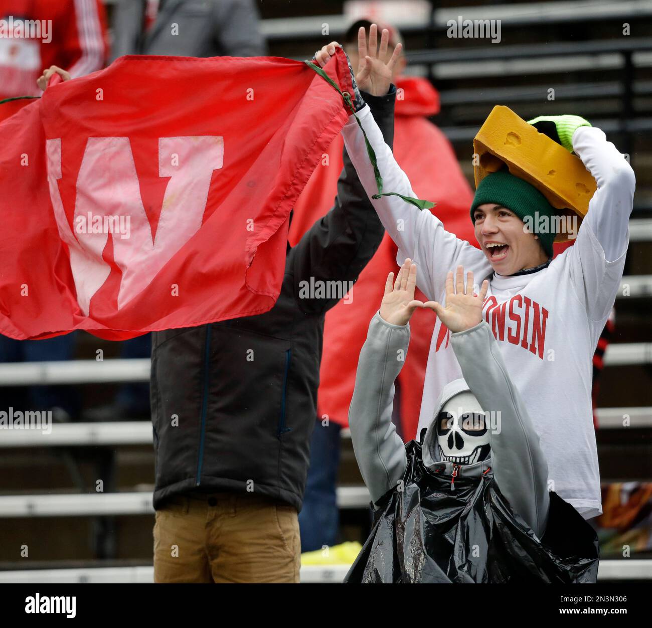 Wisconsin fans celebrate late in the second half of an NCAA college ...