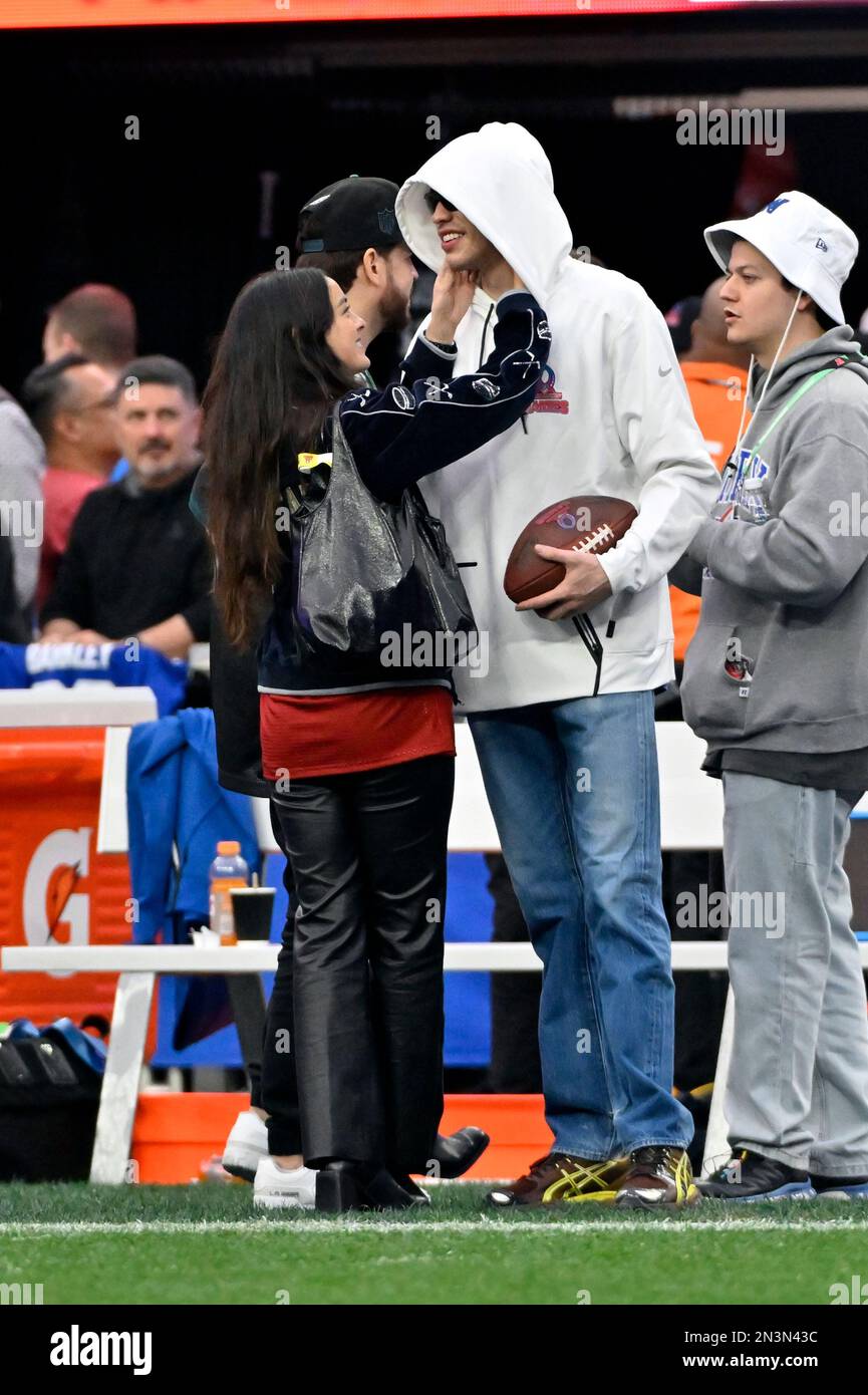 Chase Sui Wonders, left, and NFC team captain Pete Davidson embrace on ...