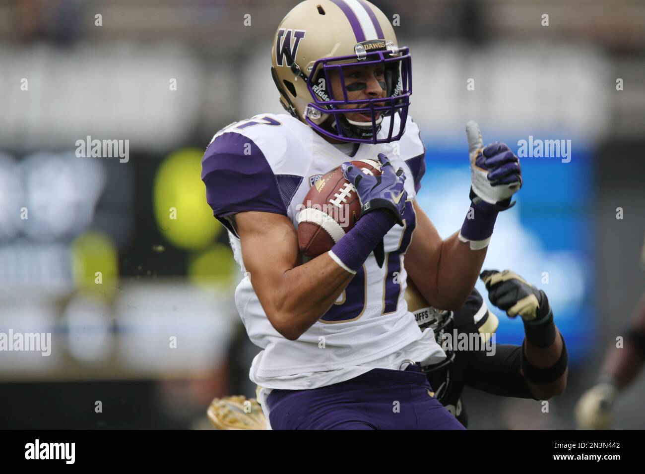 Washington wide receiver Dante Pettis, front, pulls in pass for a long ...