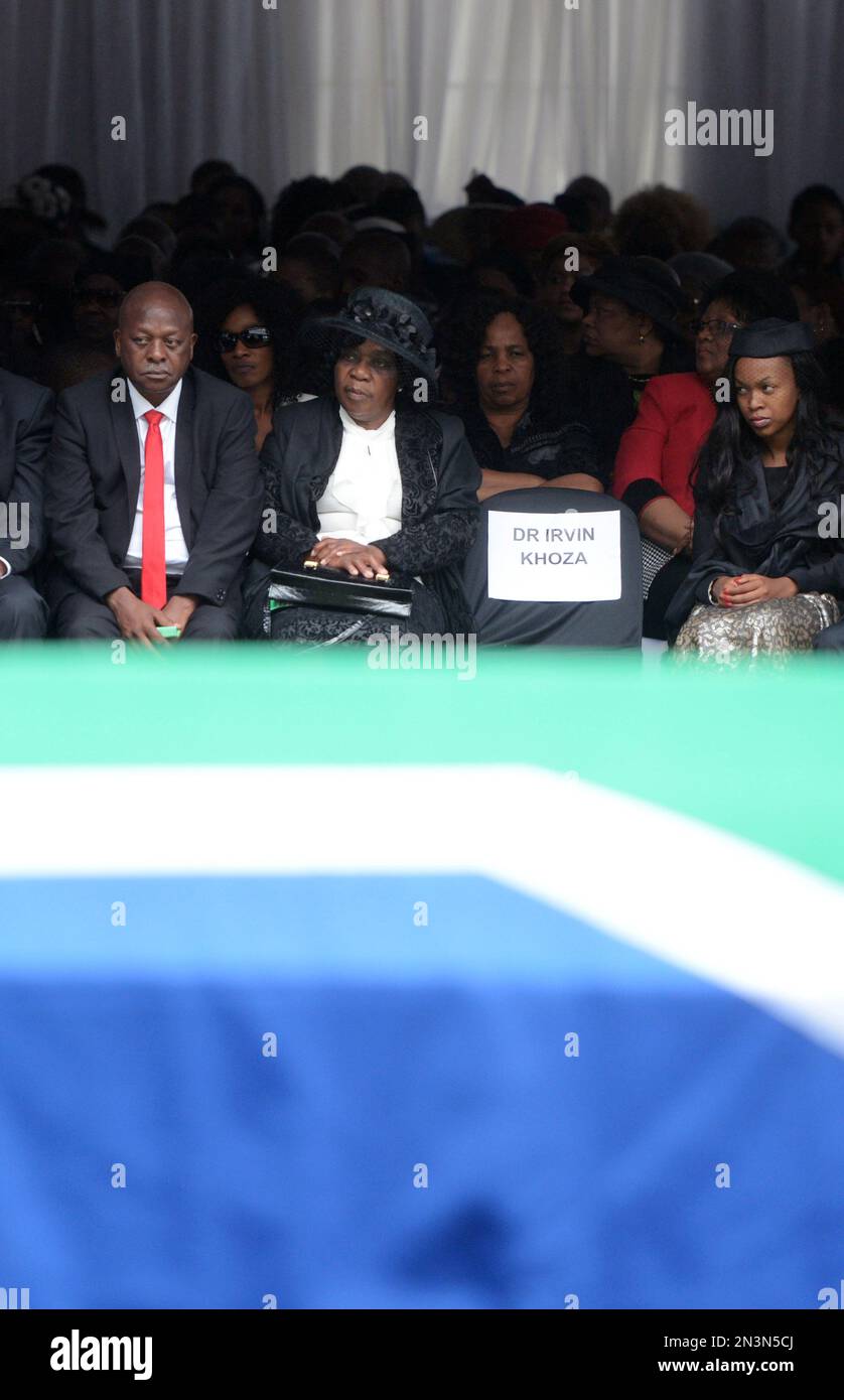 The wife of slain Senzo Meyiwa, Mandisa Meyiwa, right, and his father ...