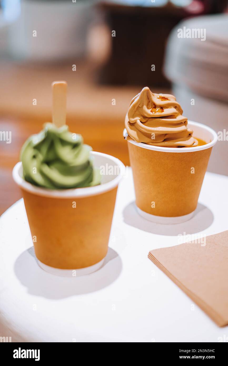 A mouth-watering shot of two scoops of ice cream, with a matcha ...