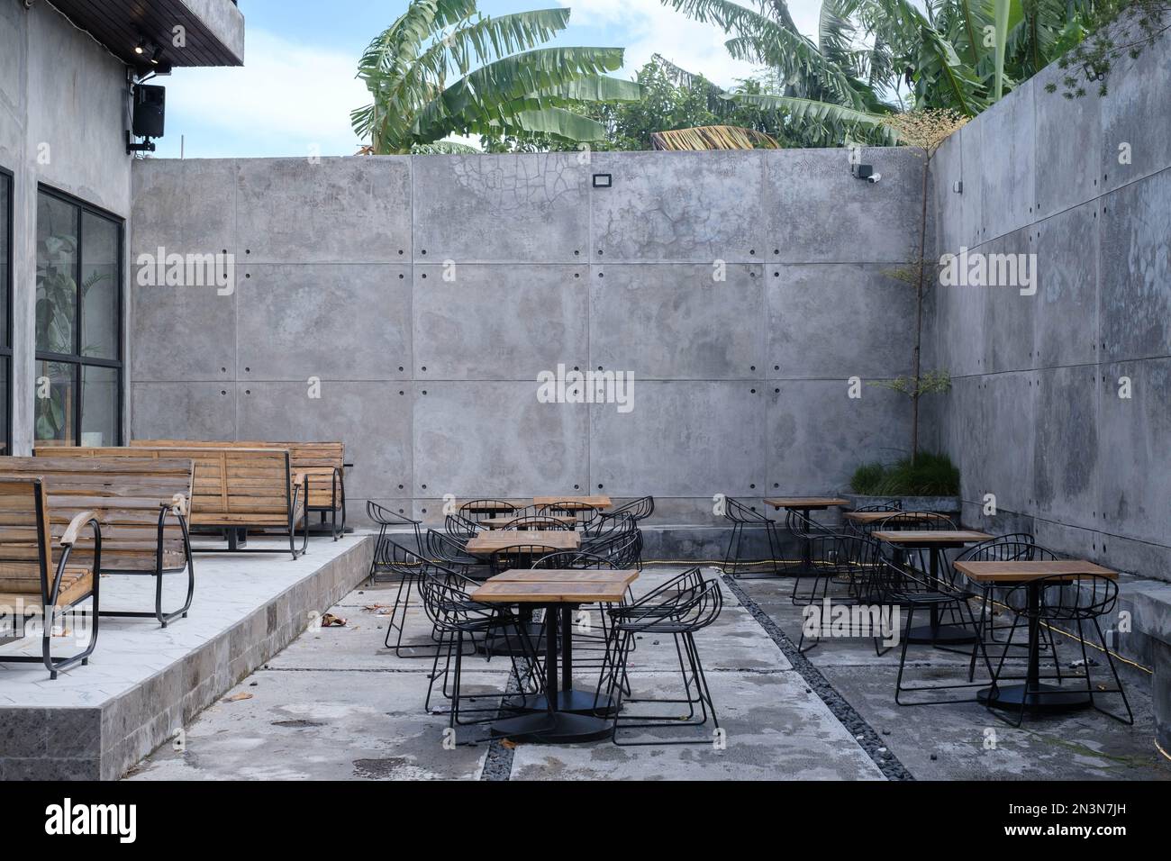 Stylish industrial cafe with concrete walls and floor, offering unique ...